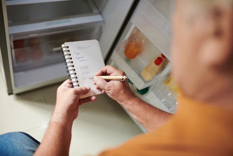 Elderly Man Writing Down Shopping List Stock Image - Image of order ...
