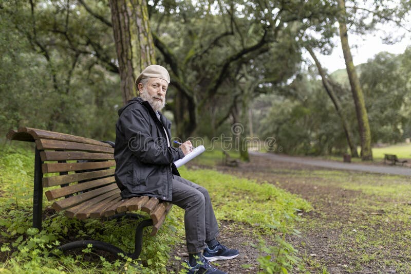 Senior Writer Taking Notes in Peaceful Park Setting Stock Photo - Image ...
