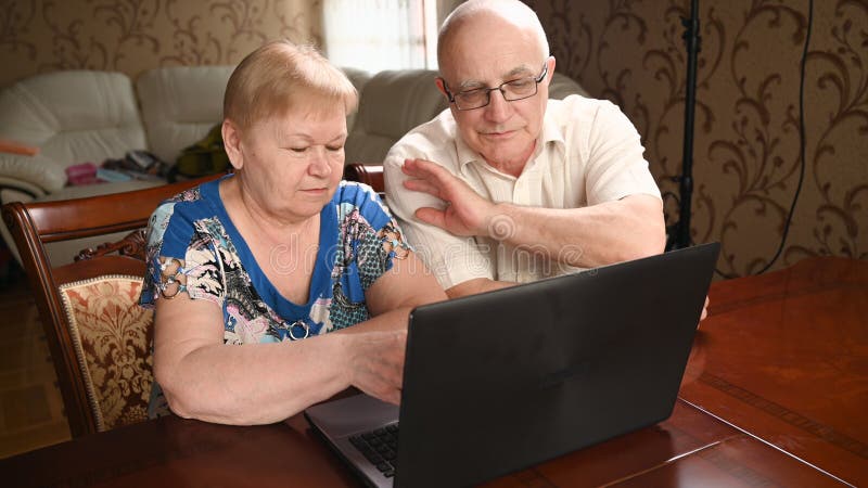 Elderly Married Couple Sitting at the Computer Upset by What they Saw ...