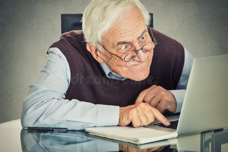Elderly Old Man Using Laptop Computer Sitting At Table Stock Photo ... Elderly Old Man Using Laptop Computer Sitting At Table Stock Photo ...