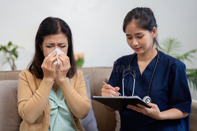 Elderly Patient Experiencing Discomfort, Caregiver Providing Support ...