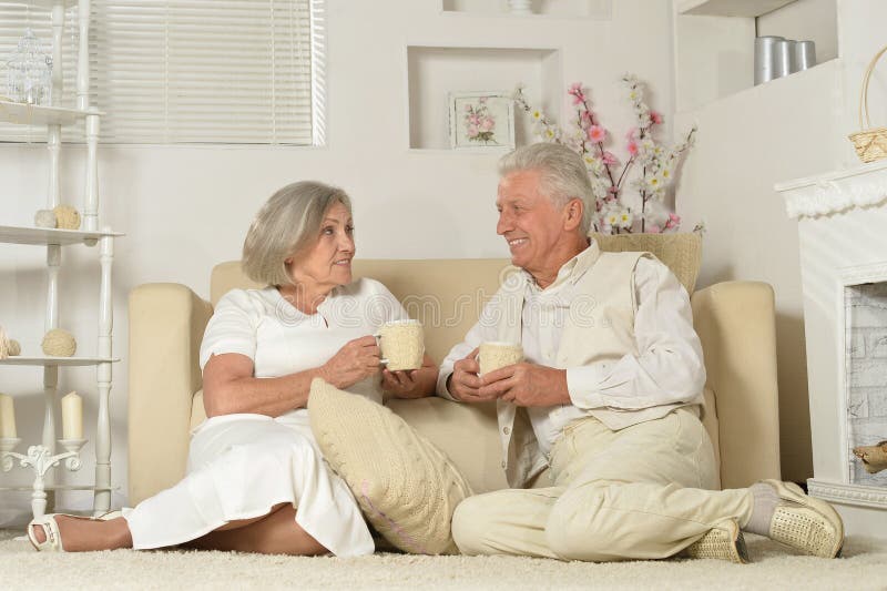 Elderly people with tea stock image. Image of couple - 63986893