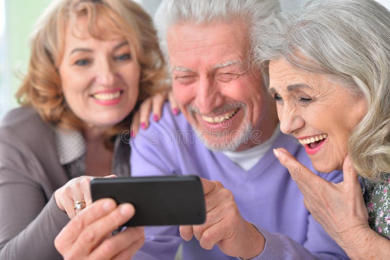 Elderly People Using Mobile Phone Stock Photo - Image of love ...
