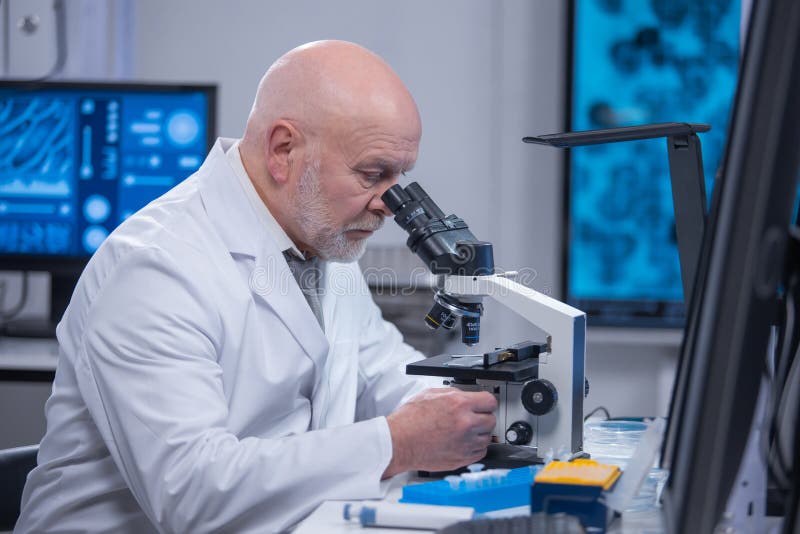 Elderly Professor is Doing a Science Experiment in a Modern Laboratory ...