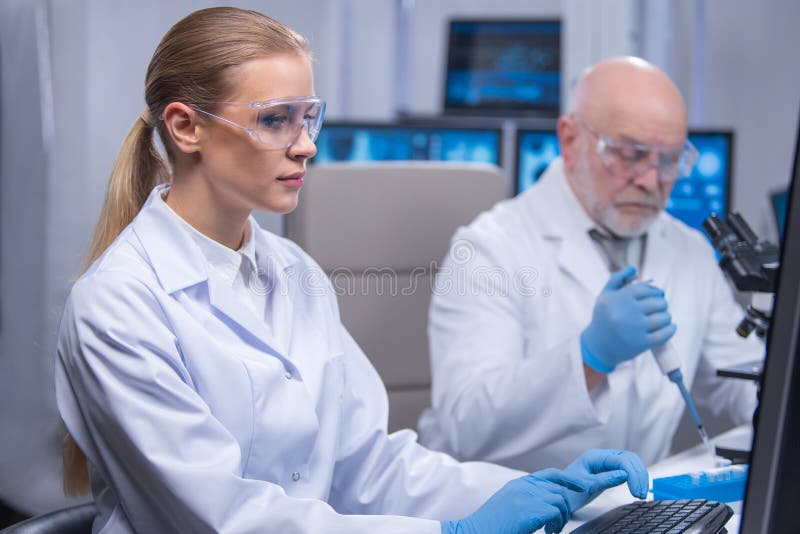 Professor and His Young and Professional Laboratory Assistant are Doing ...