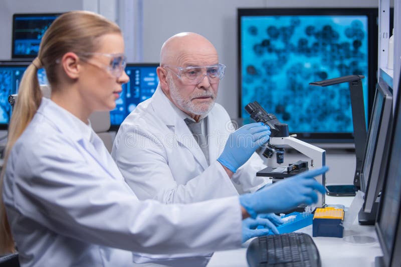 Professor and His Young and Professional Laboratory Assistant are Doing ...