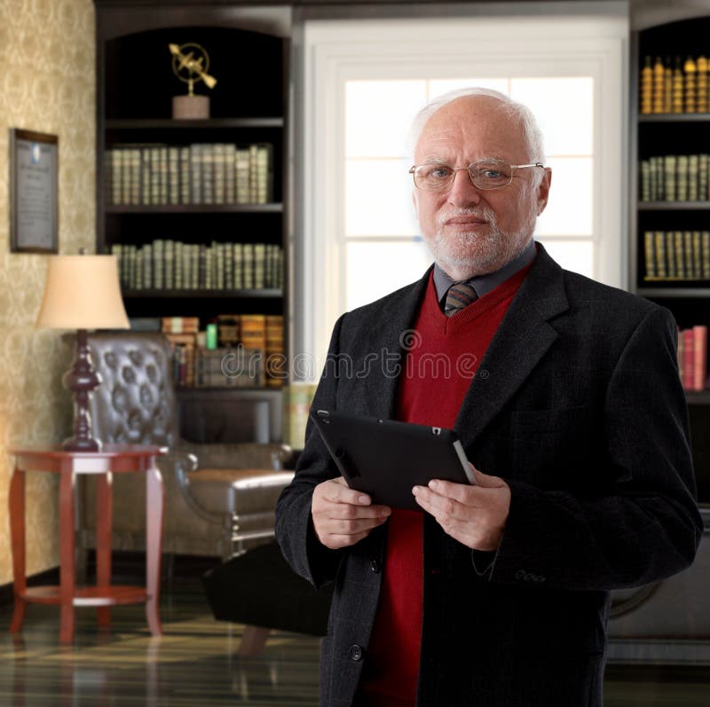 Elderly Professor at Study Holding Tablet Computer Stock Image - Image ...