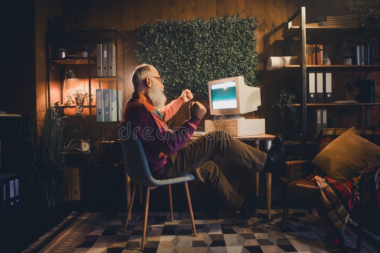 Elderly Programmer Celebrates Successful Code in Cozy Home Office ...