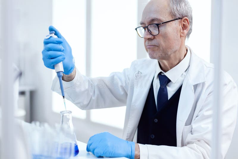 Elderly Scientist Doing Pharmaceutical Experiment Stock Photo - Image ...