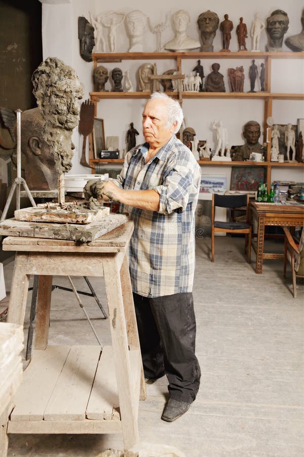 Sculptor Creates a Bust and Puts His Hands Clay on the Skeleton of the ...