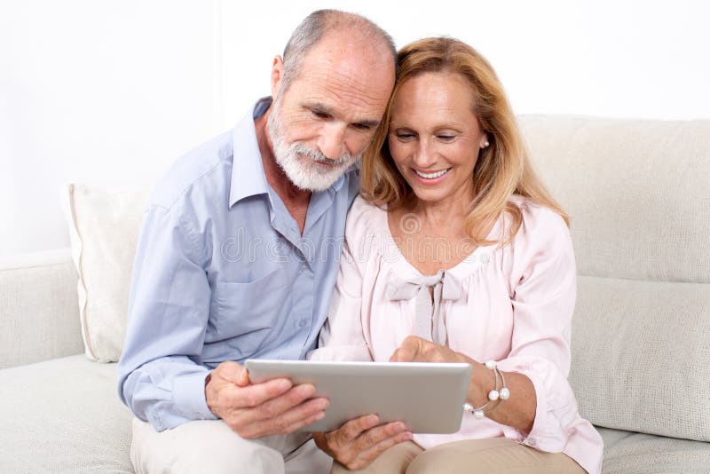 Senior Couple Looking at Digital Tablet Stock Image - Image of ...