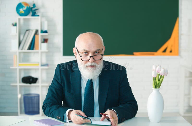 Elderly Senior Professor Reading an Old Book in the Library, Knowledge ...