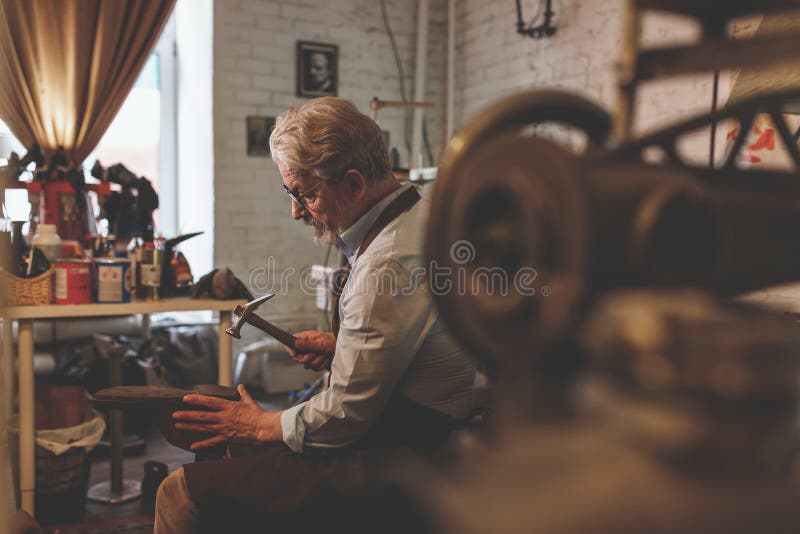 An Elderly Shoemaker at Work Stock Photo - Image of craft, person ...