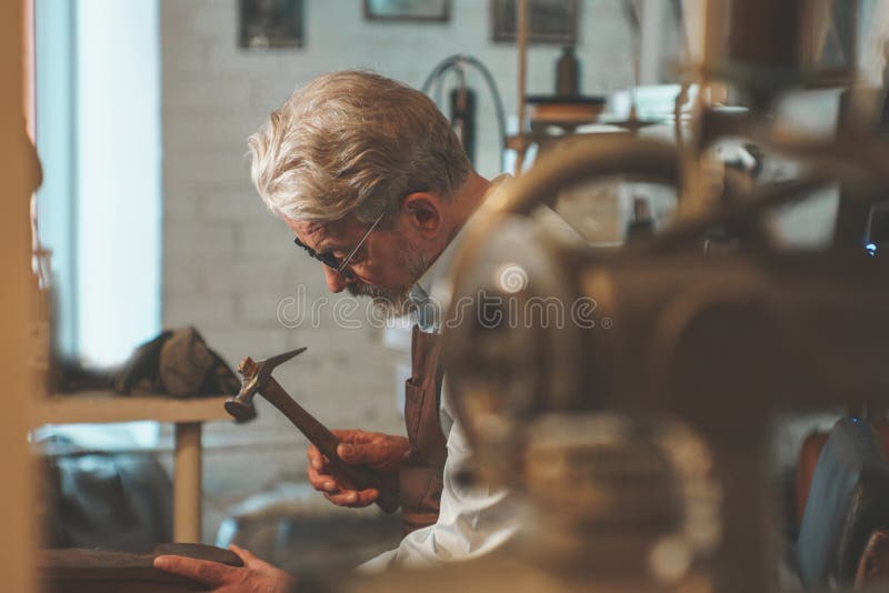 An Elderly Shoemaker at Work Stock Image - Image of machine, making ...