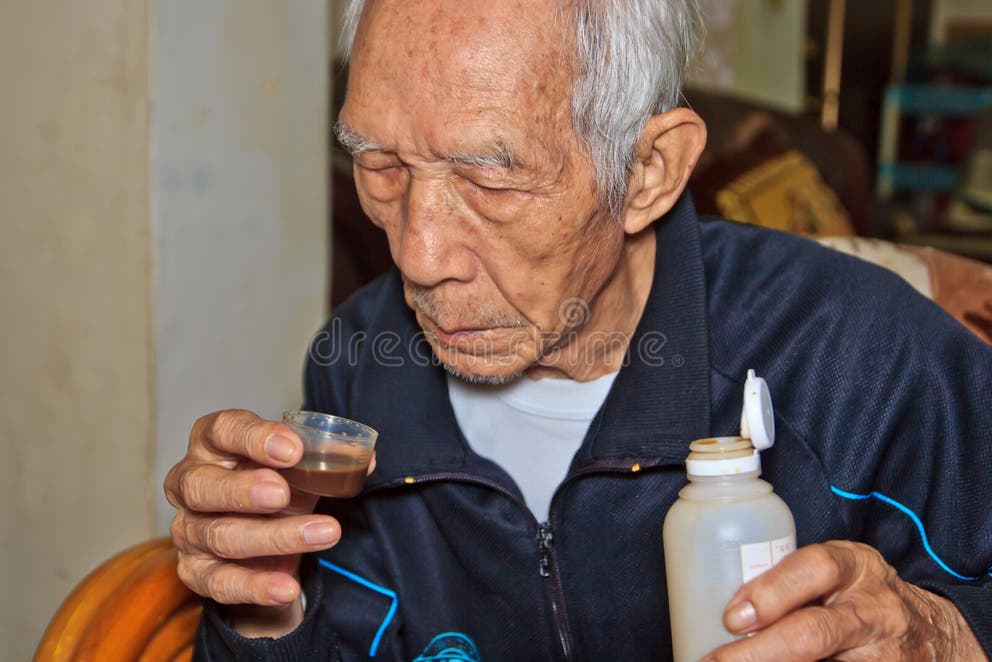The Elderly To Drink Cough Syrup Stock Image - Image of white, drink ...
