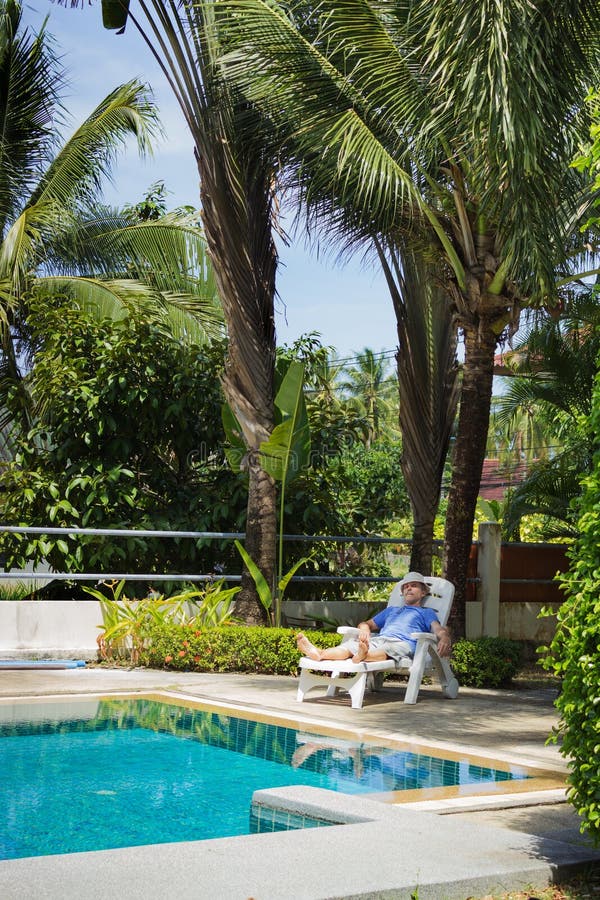 Elderly Tourist Resting by the Pool Stock Photo - Image of lounger ...