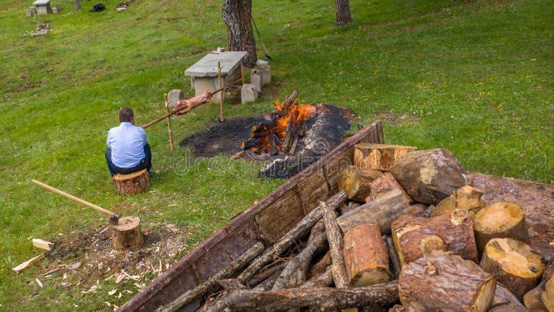 Elderly Turkish Man Roasting Lamb Over Open Fire in Traditional Style ...