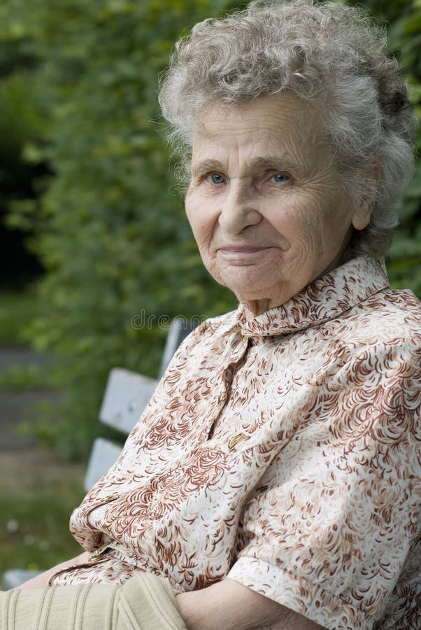 Elderly Woman Enjoying a Peaceful Moment Stock Image - Image of elderly ...