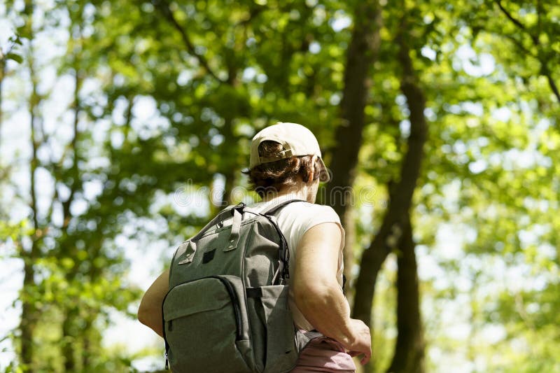 Elderly Woman with Backpack Hiking in Forest. Back View Stock Image ...