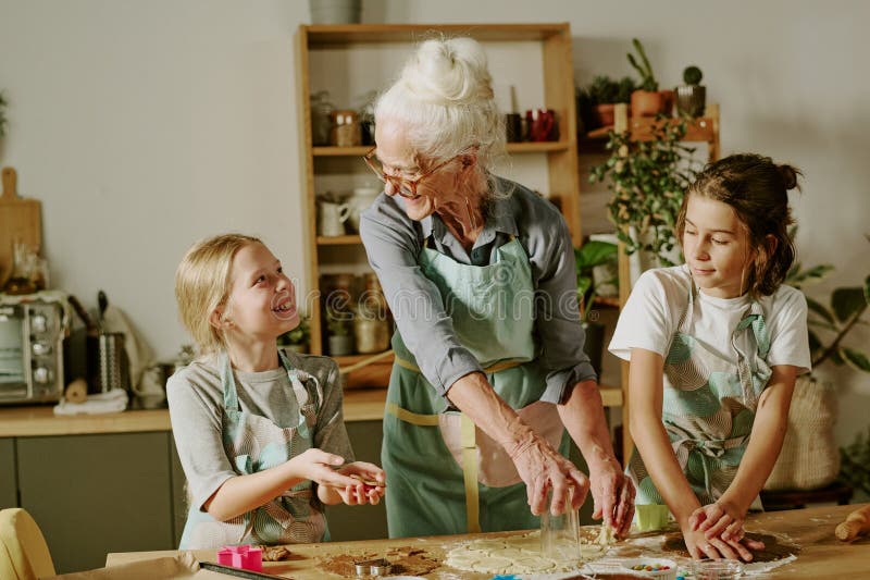 Elderly Woman Baking with Children in Cozy Kitchen Stock Photo - Image ...