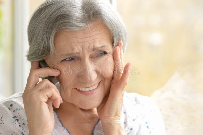 Elderly woman calling stock photo. Image of elder, headache - 53873978