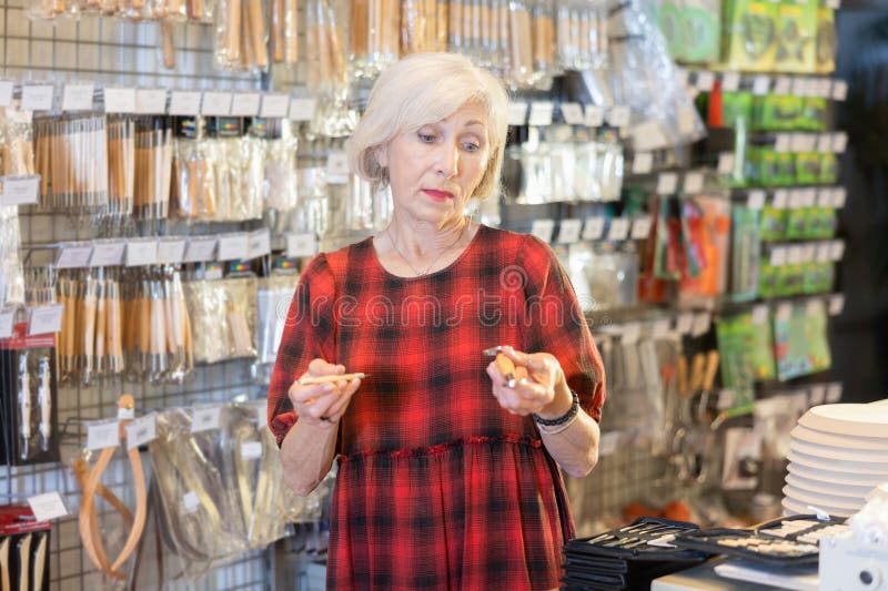 Elderly Woman Chooses Tools for Working with Clay and Creating Clay ...