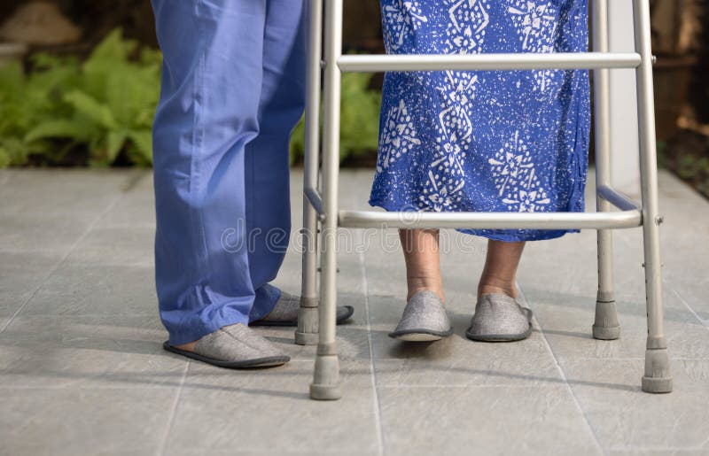 Elderly Woman Exercise Walking in Backyard with Caregiver Stock Photo ...