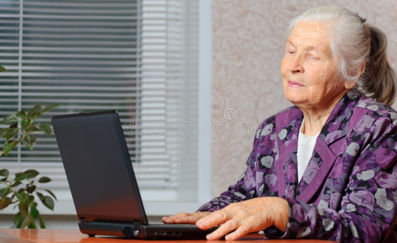 Senior Lady On The Computer Stock Image - Image of elderly, years: 18259099