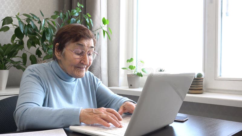 Elderly Woman in Glasses Working on Computer at Home Stock Image ...