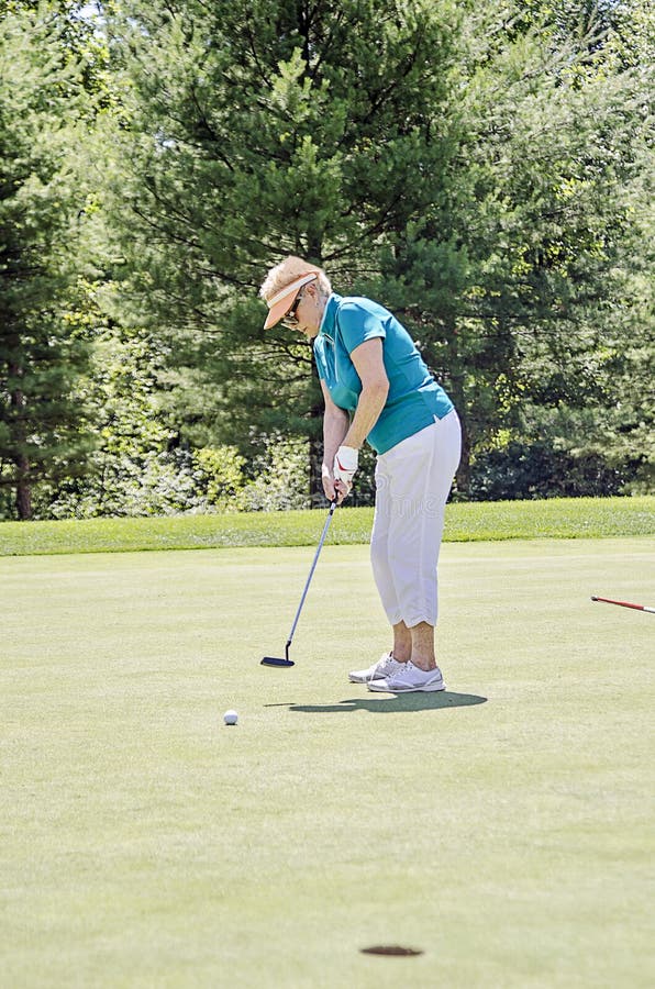 Elderly Woman golfing stock image. Image of enjoy, older - 76104901