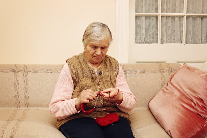 Elderly Woman Knitting With Red Wool Stock Image Image Of Creative