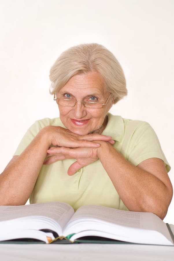 Elderly Woman Reading a Book Stock Photo - Image of brunette, looking ...