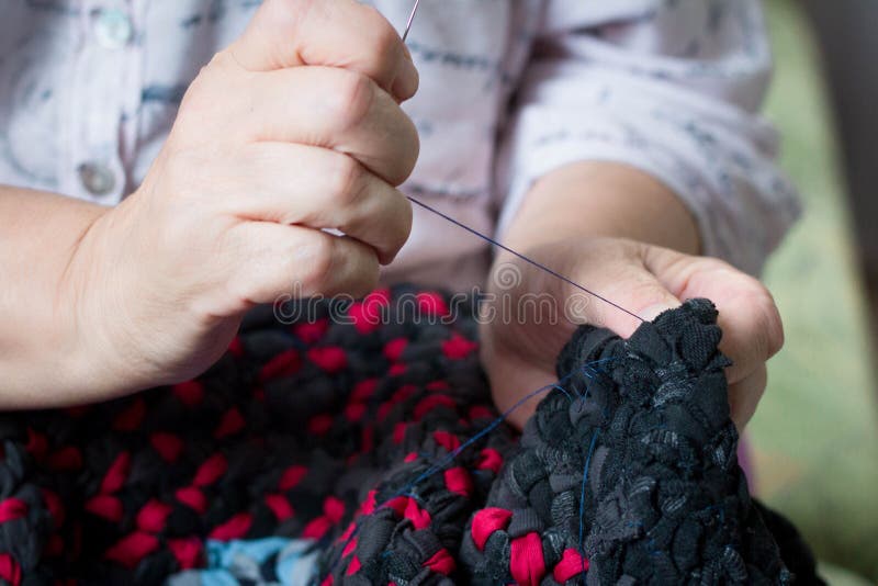 Elderly Woman Sews with Needle and Thread Doing Hand Work Stock Image ...