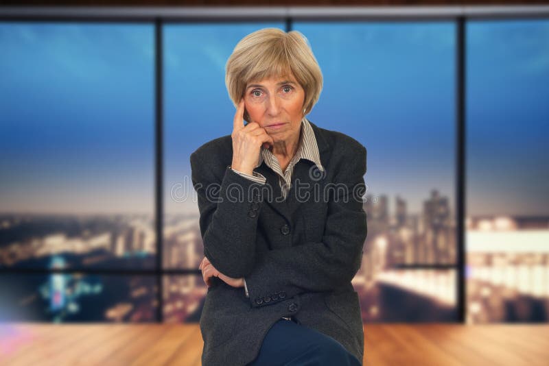 Elderly Woman Thinking in the Office Stock Photo - Image of ...