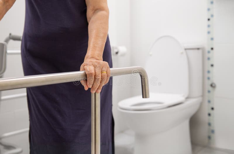 Elderly Woman Using Bathroom Safety Rail Stock Photo - Image of health ...