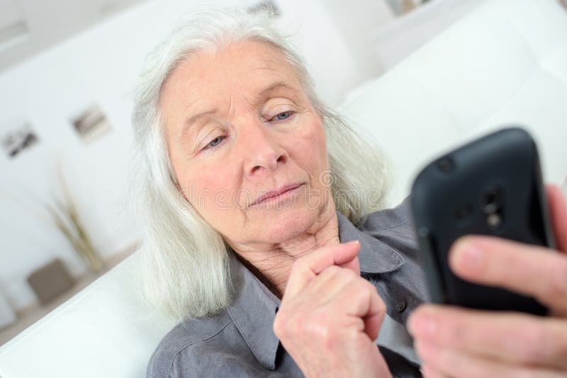 Elderly Woman Using Cellphone Stock Photo - Image of smartphone ...