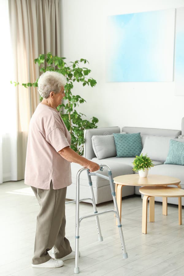 Elderly Woman Using Walking Frame Stock Photo - Image of equipment ...