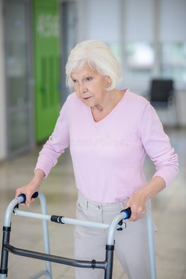 Elderly Woman Walking with a Rolling-walker Stock Image - Image of ...