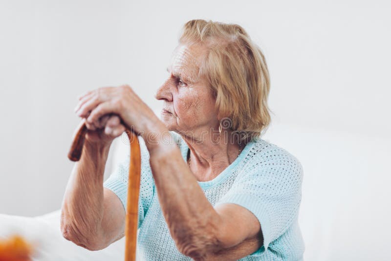 Elderly Woman with a Walking Stick Stock Image - Image of cane ...