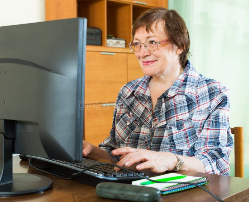 Elderly Woman Working with Computer Stock Photo - Image of clothes ...