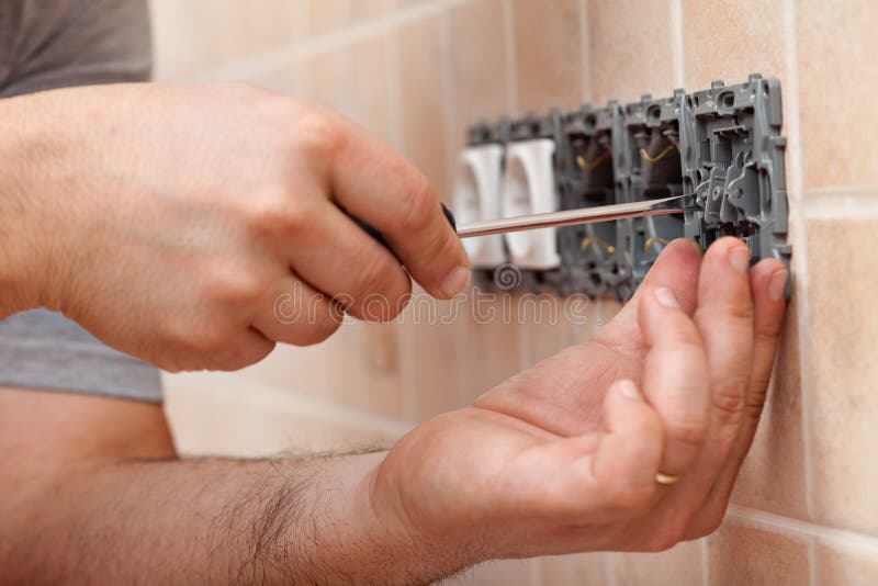 Electician Hands Installing Electrical Wall Fixture Stock Image - Image ...