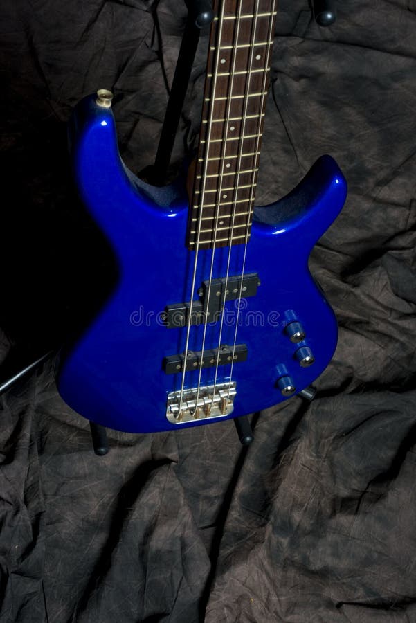 Electric Bass Guitar on Stand Stock Photo - Image of musical, angle ...