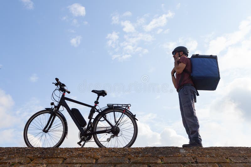 Electric Bicycle Delivery Person Prepared for Work Stock Photo - Image ...