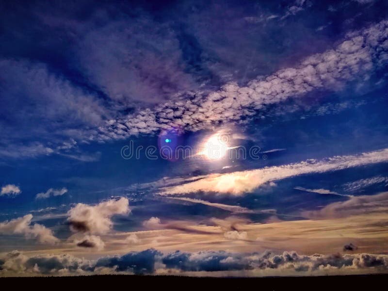 Electric blue sky and sun stock photo. Image of blue - 163350342