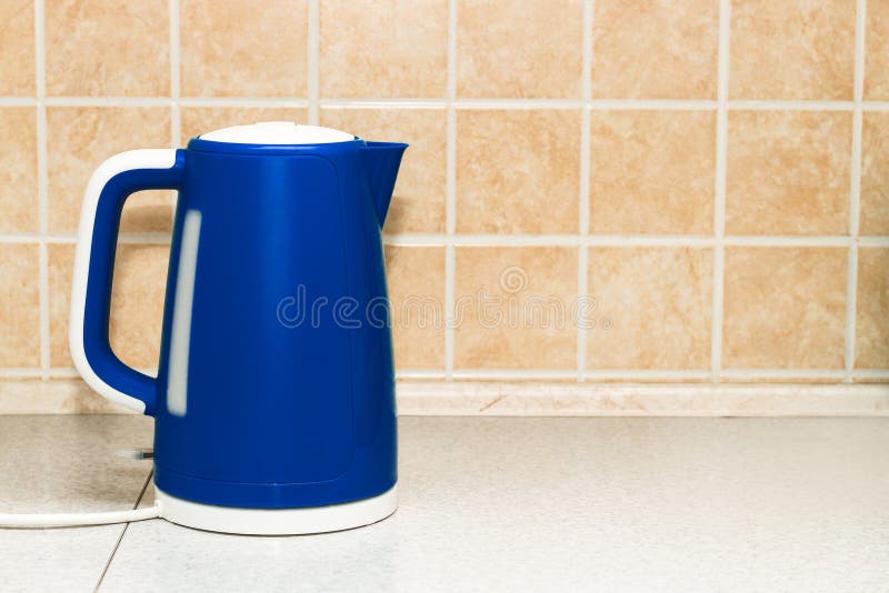 An Electric Bright Kettle Heats Water in the Kitchen Stock Image ...