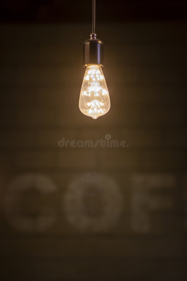 Electric Bulb in the Cafe with Coffee Written on the Wall Stock Photo ...