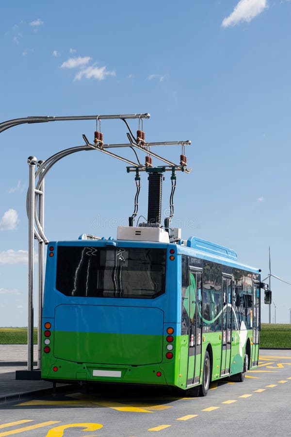 Electric Bus at a Stop is Charged by Pantograph. Stock Photo - Image of ...