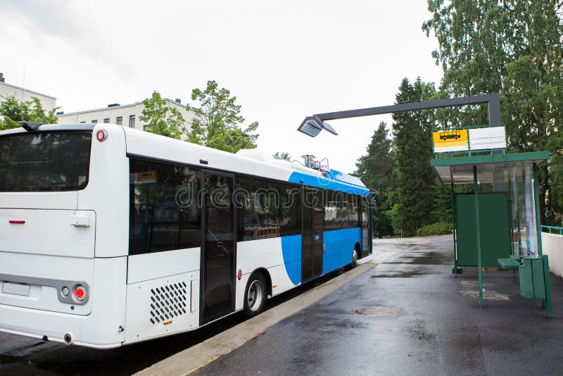 Electric bus at a stop stock photo. Image of street, device - 99565624