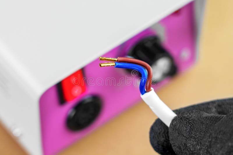 Electric Cable with Bare Exposed Wires and Copper Terminals in the Hand ...