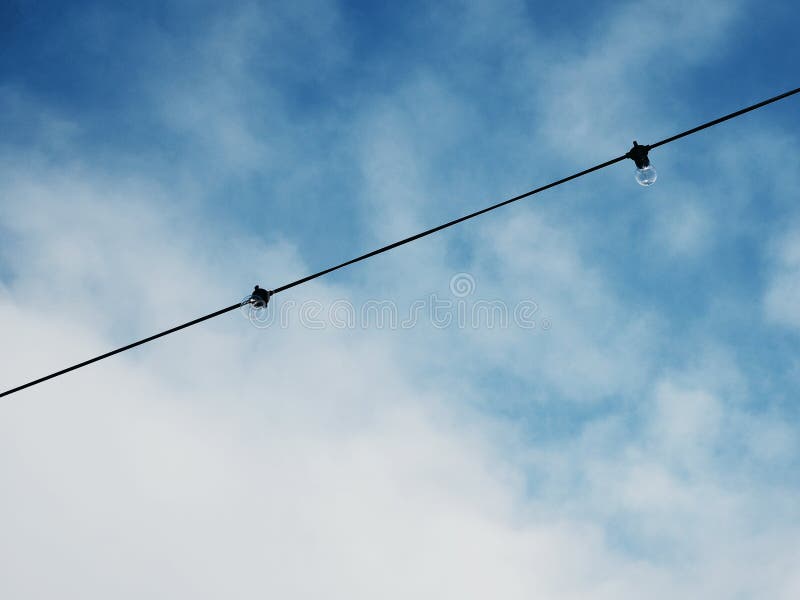 Electric Cable With Light Bulb Under Bright Sky Picture. Image: 82951287